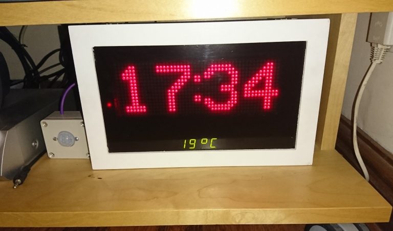 A large animated LED matrix clock with various time display modes ...